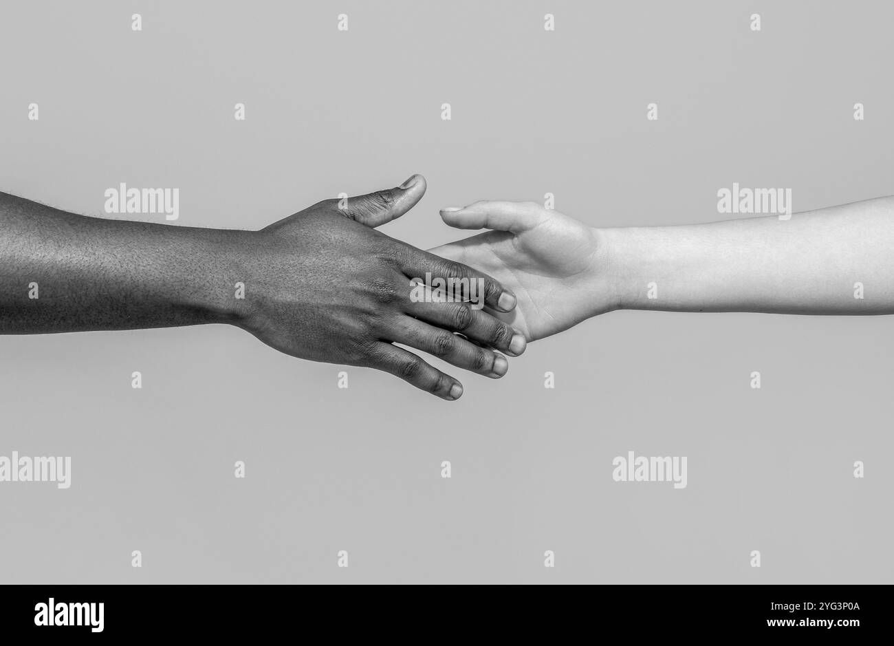 Giving a helping hand to another. Woman and african woman hand. Black ...