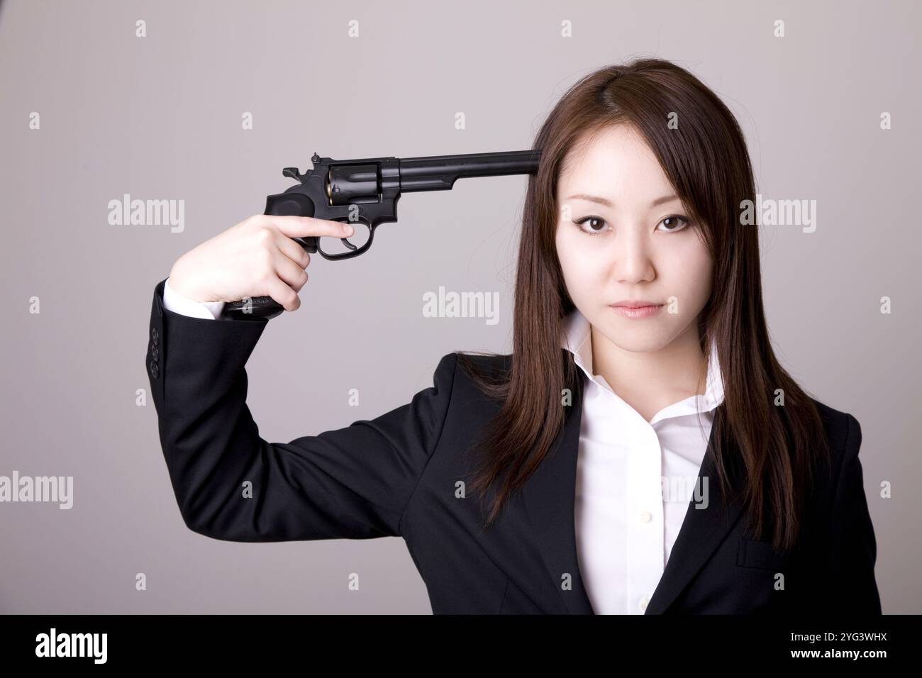 Woman with revolver-type gun Stock Photo - Alamy