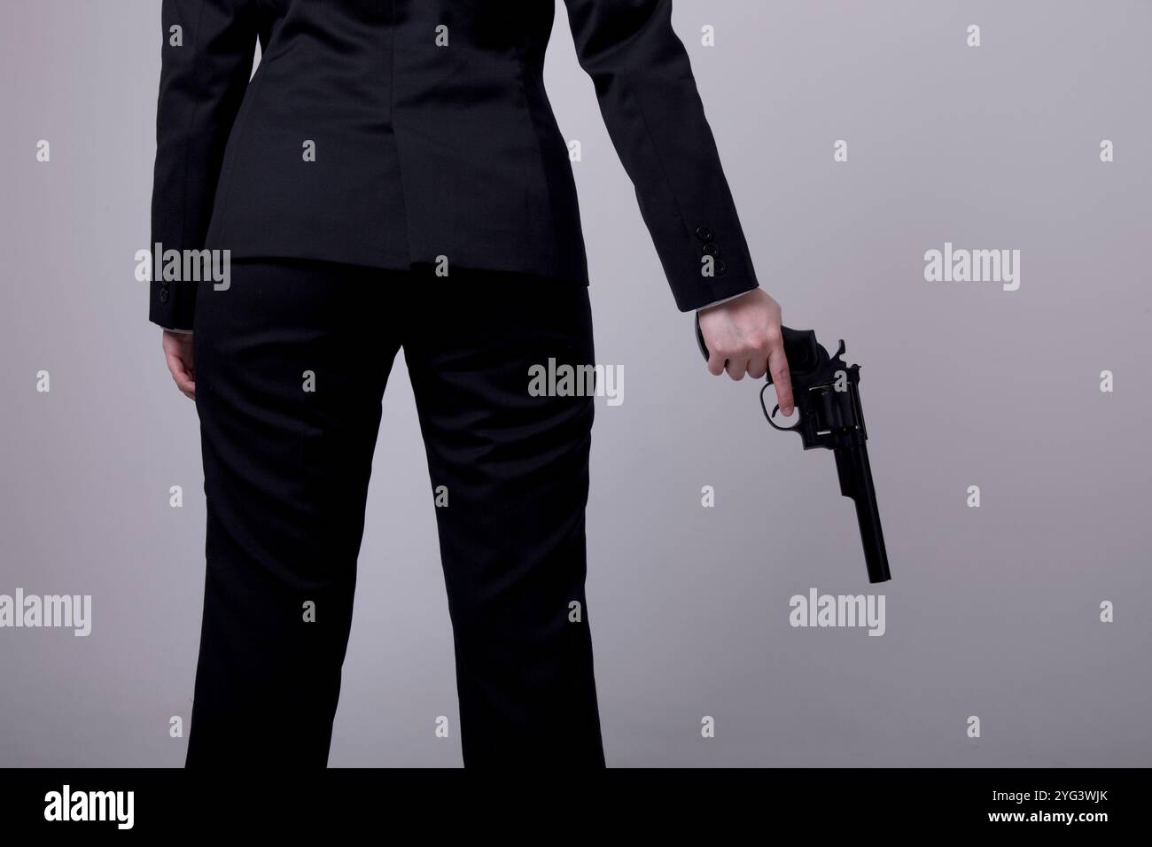 Woman with revolver-type gun Stock Photo - Alamy