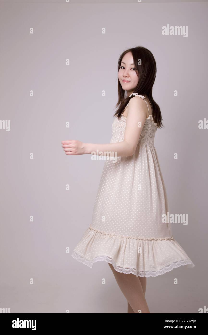 Woman turning around Stock Photo - Alamy