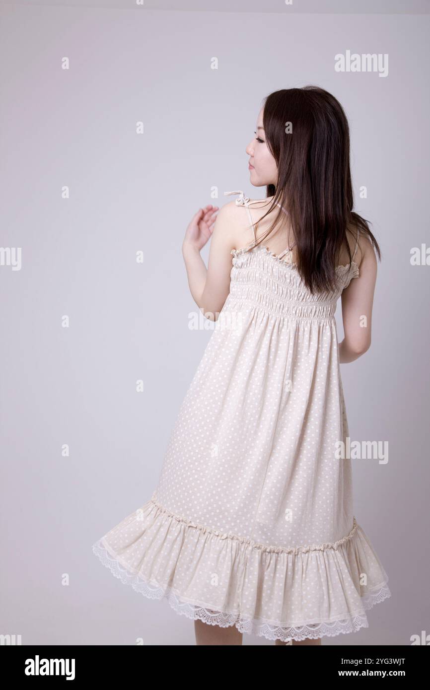 Young woman turning around hi-res stock photography and images - Alamy