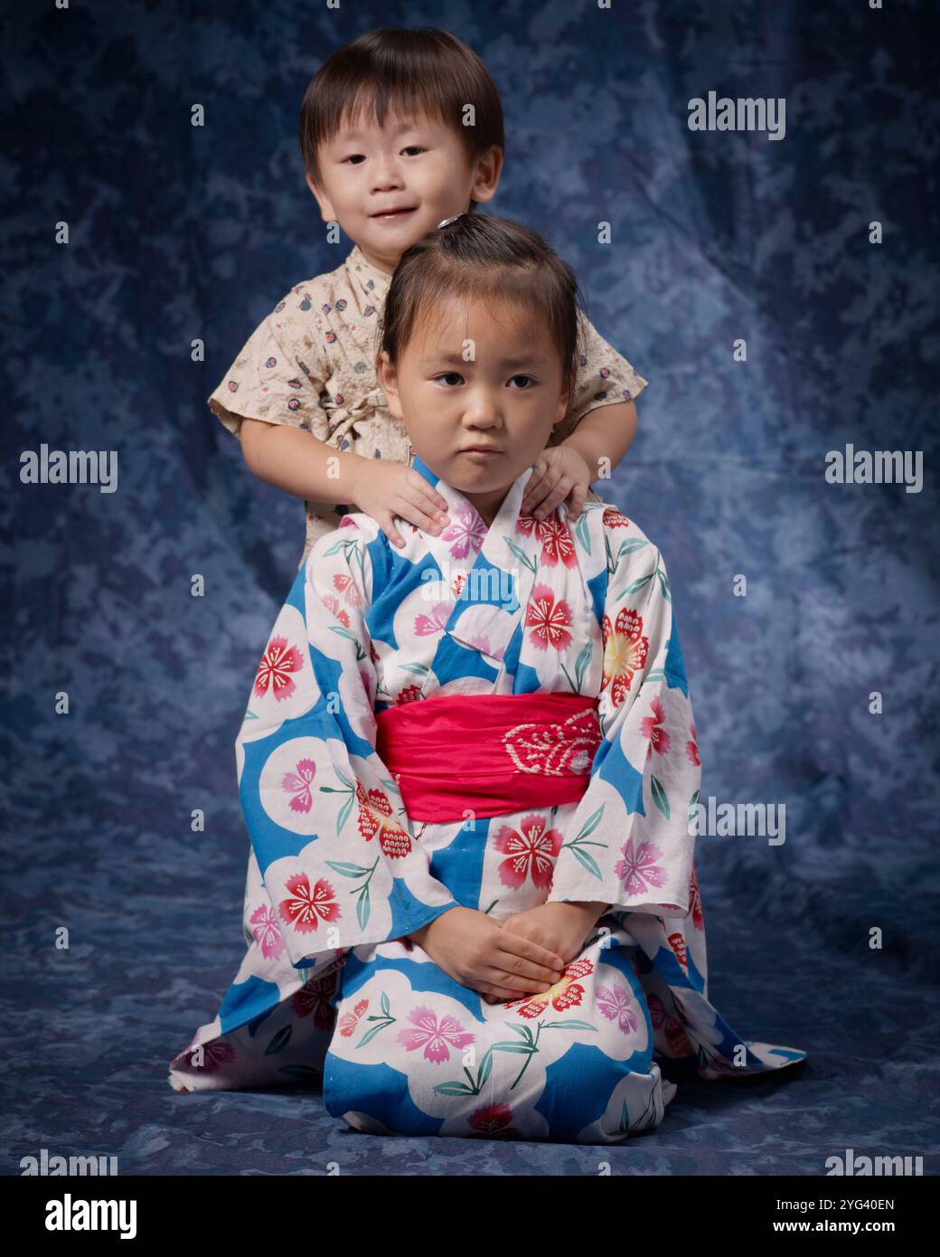 Brother putting his hand on the shoulder of the yukata-clad sister from ...