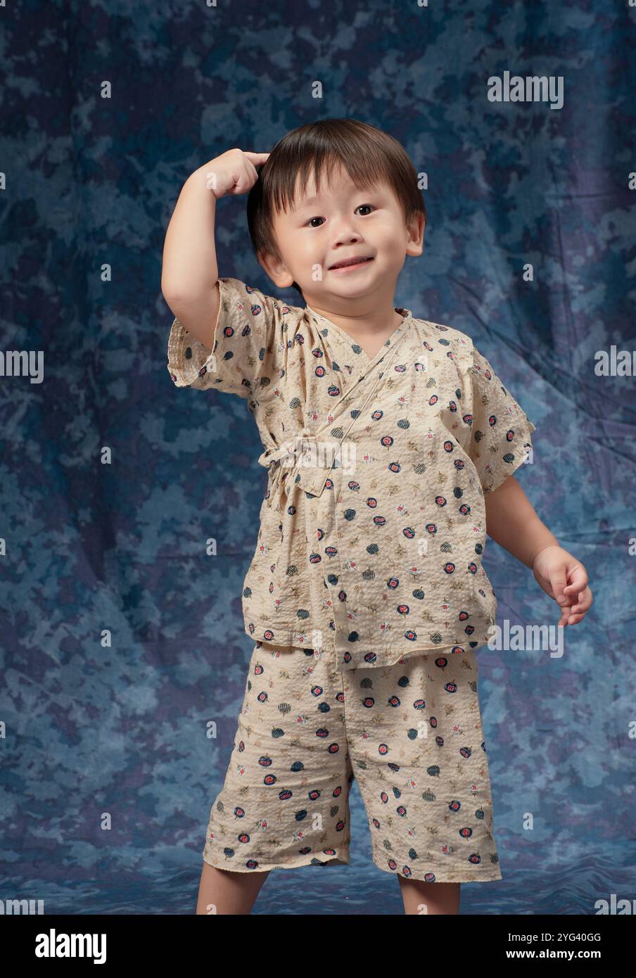 Boy with his hand to his head hi-res stock photography and images - Alamy