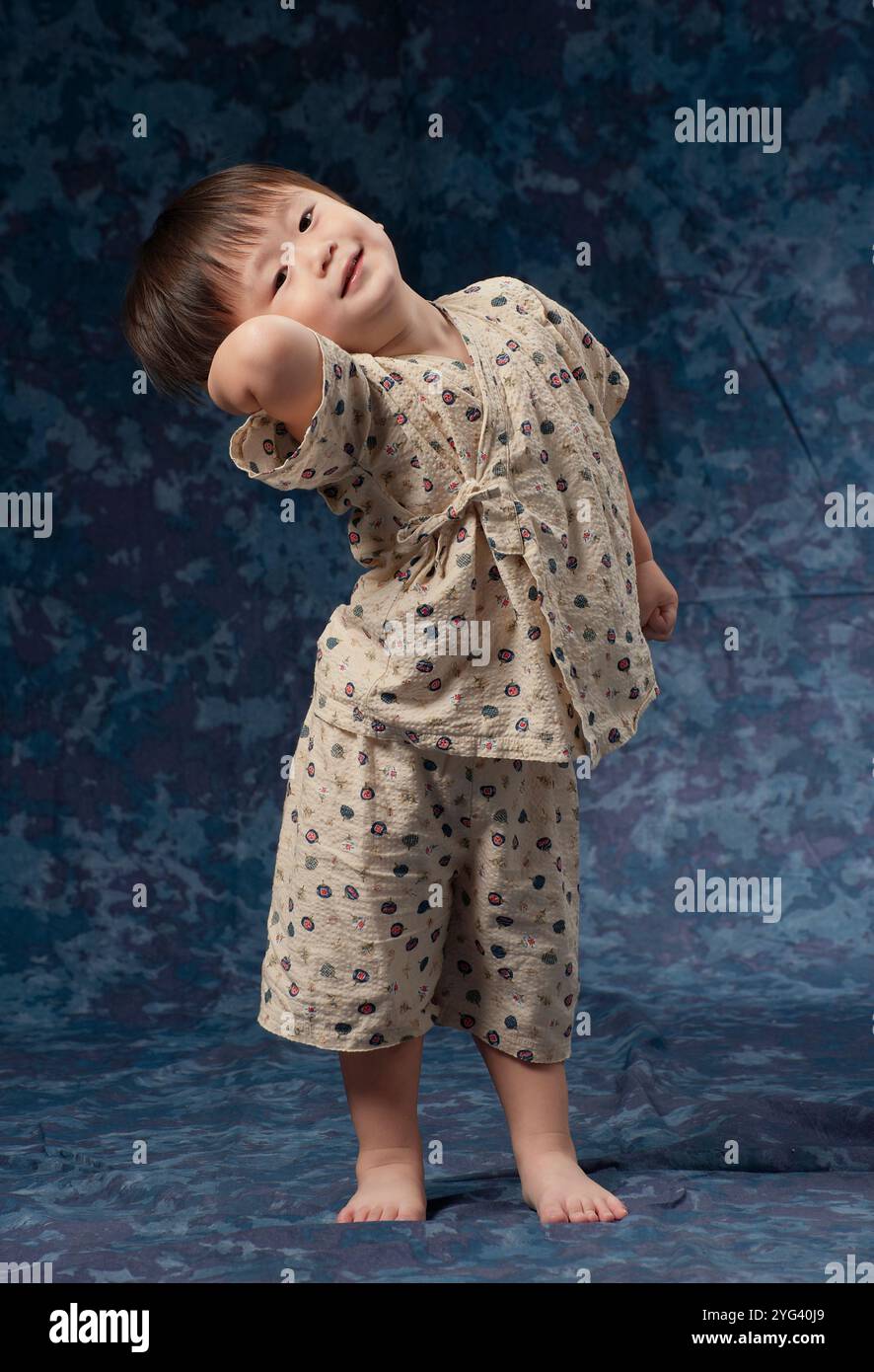 A 2-year-old child in a jinbei making a cute gesture Stock Photo - Alamy
