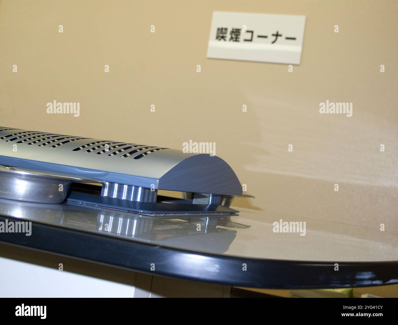 Smoking area with smoke evacuators and ashtrays Stock Photo - Alamy