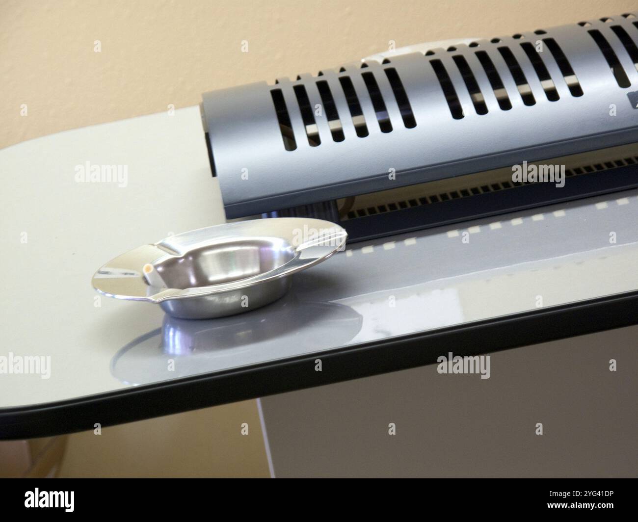 Smoking area with smoke evacuators and ashtrays Stock Photo - Alamy