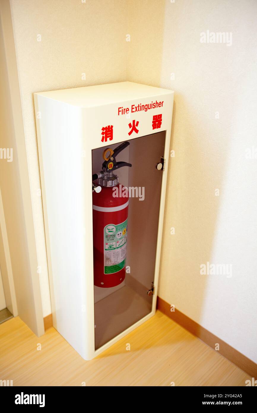 Fire extinguisher installed in the room Stock Photo - Alamy