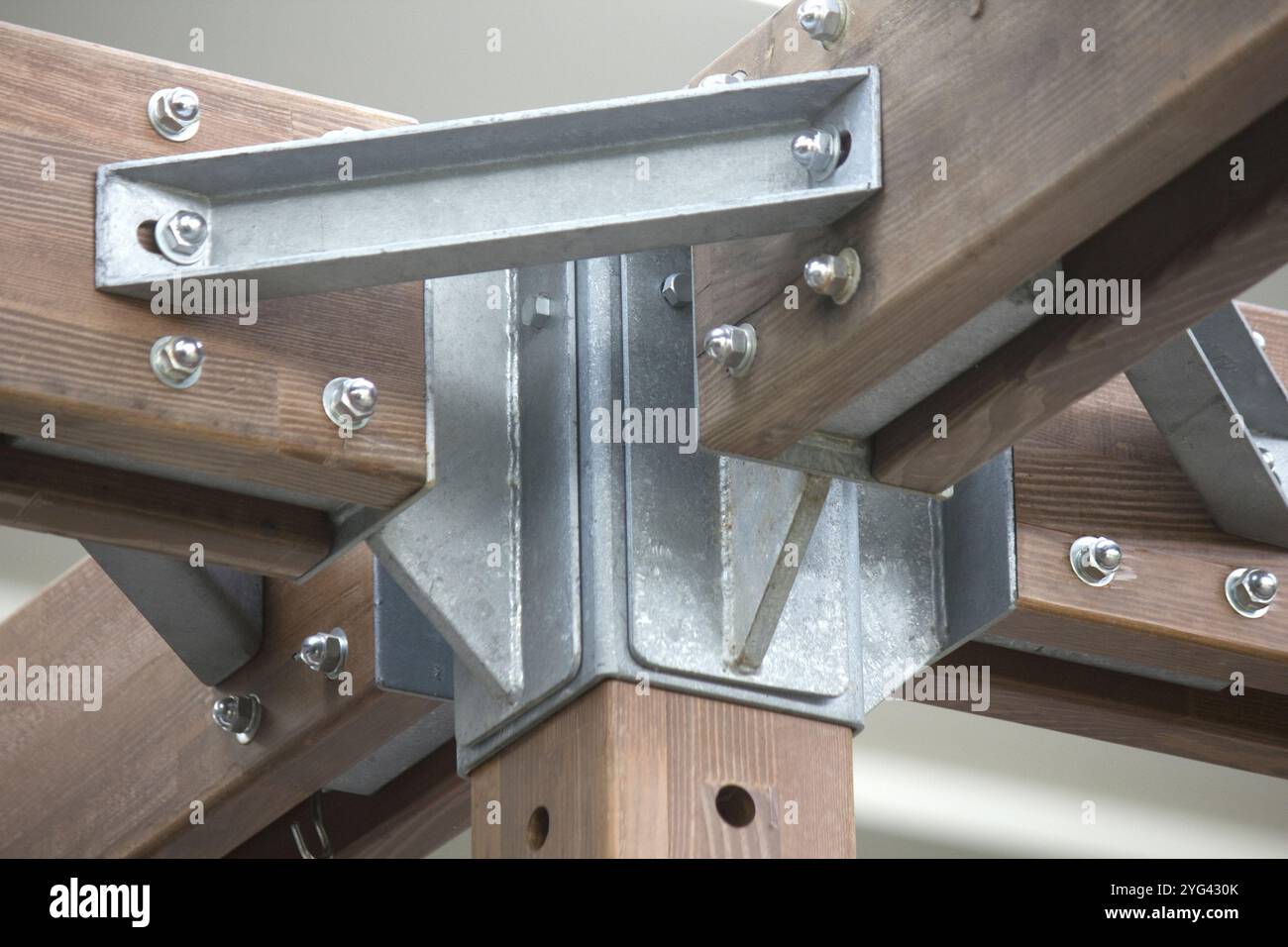 Fittings at the joints of a wooden pillar Stock Photo - Alamy