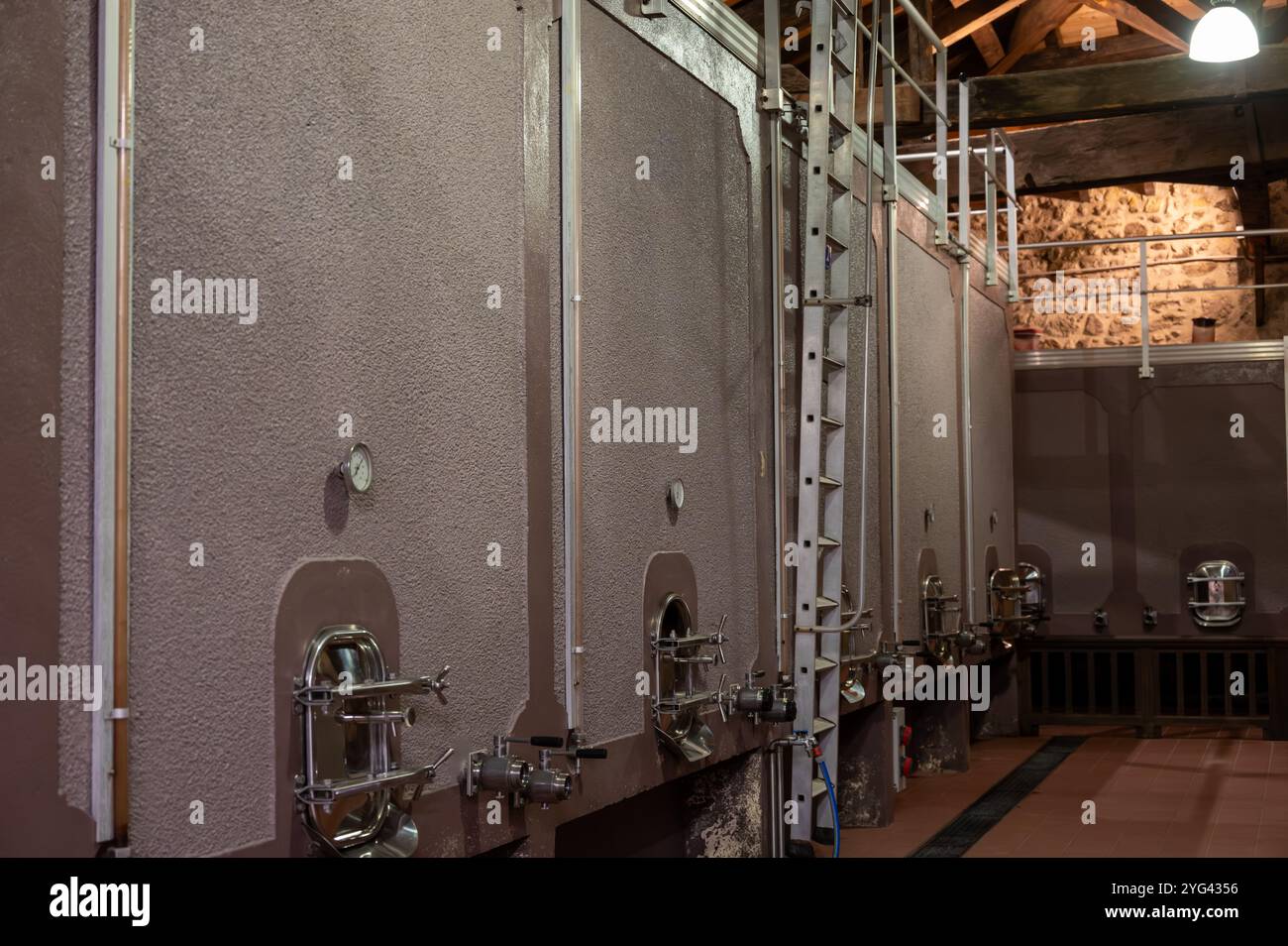 Old concrete tanks for first fermentation of grapes on Bordeaux winery ...