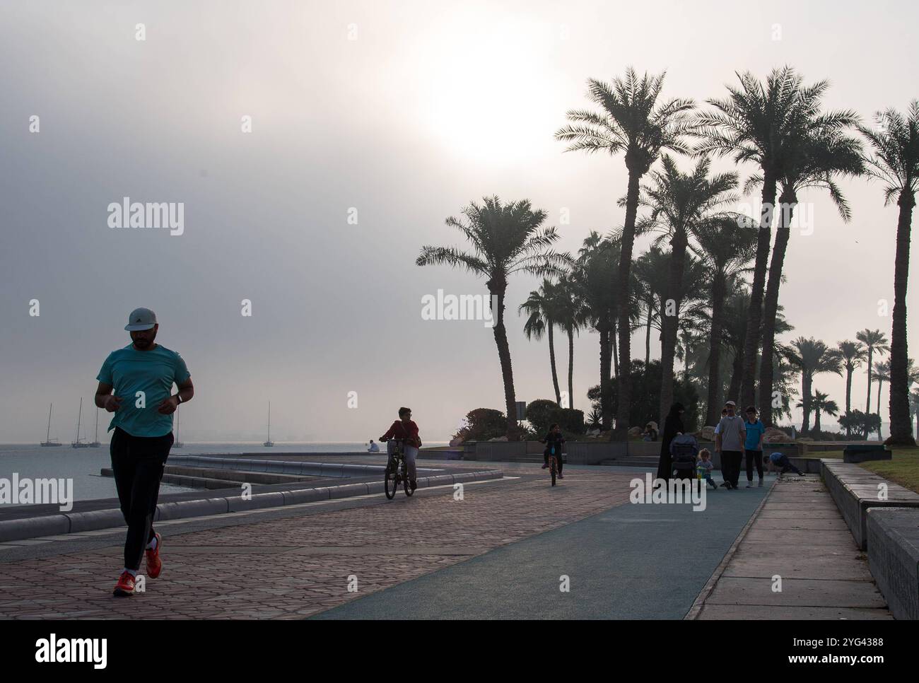 Foggy day in Doha People walk along the Doha Corniche in heavy fog on ...