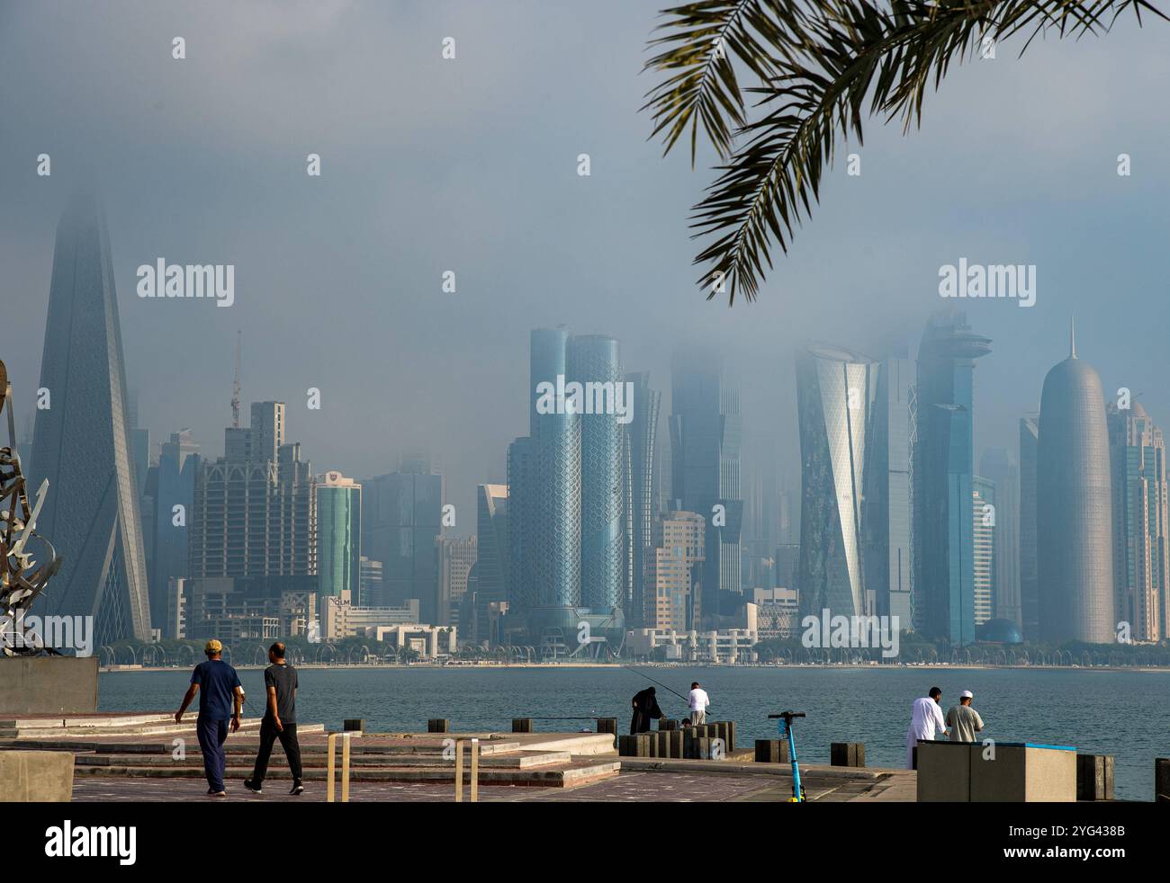 Foggy day in Doha People walk along the Doha Corniche in heavy fog on ...