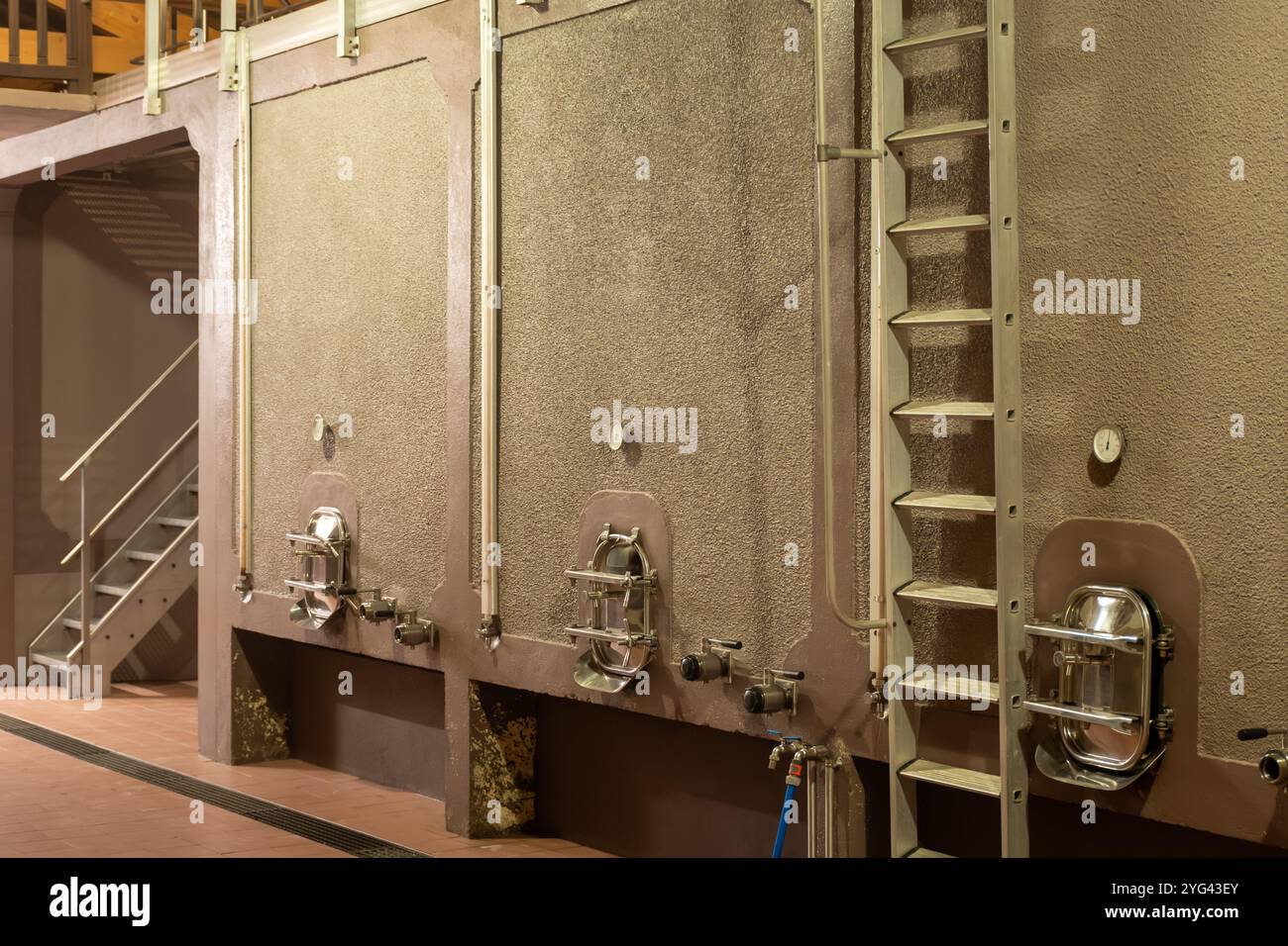 Old concrete tanks for first fermentation of grapes on Bordeaux winery ...