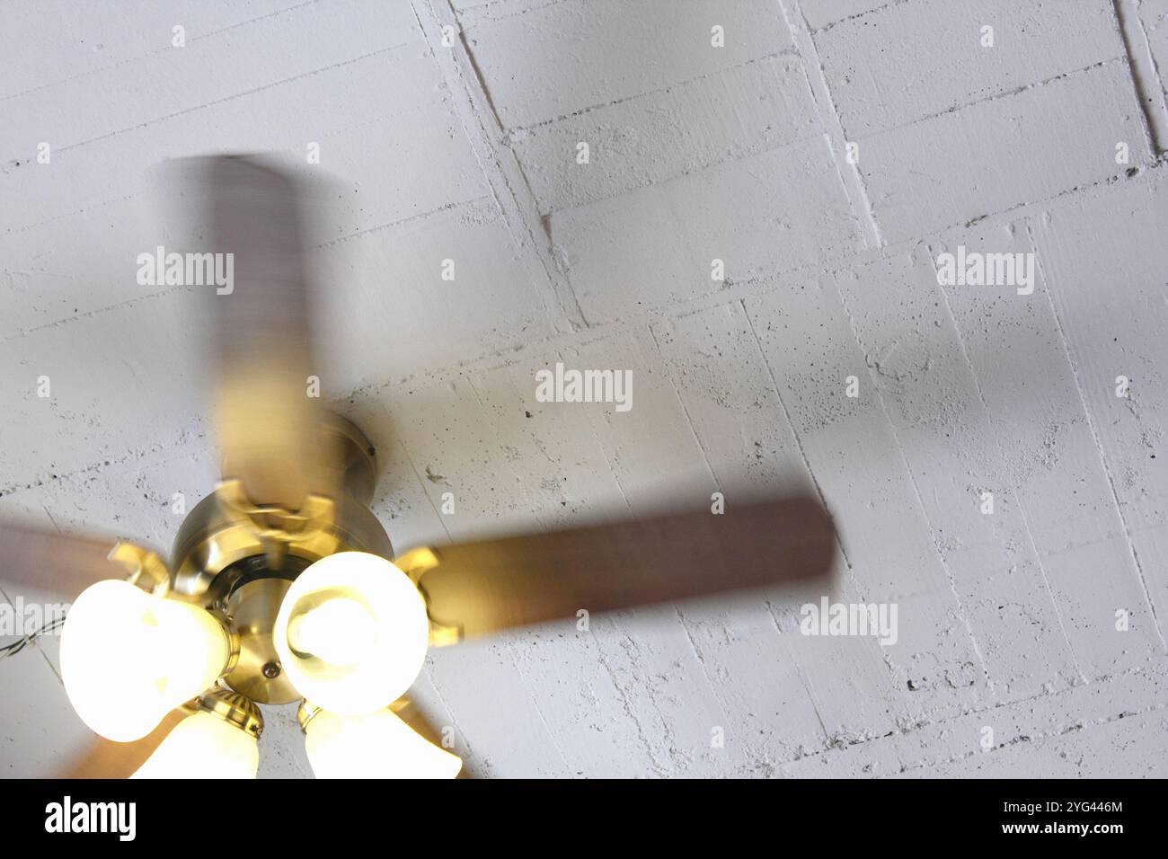 Rotating room ceiling fan Stock Photo - Alamy
