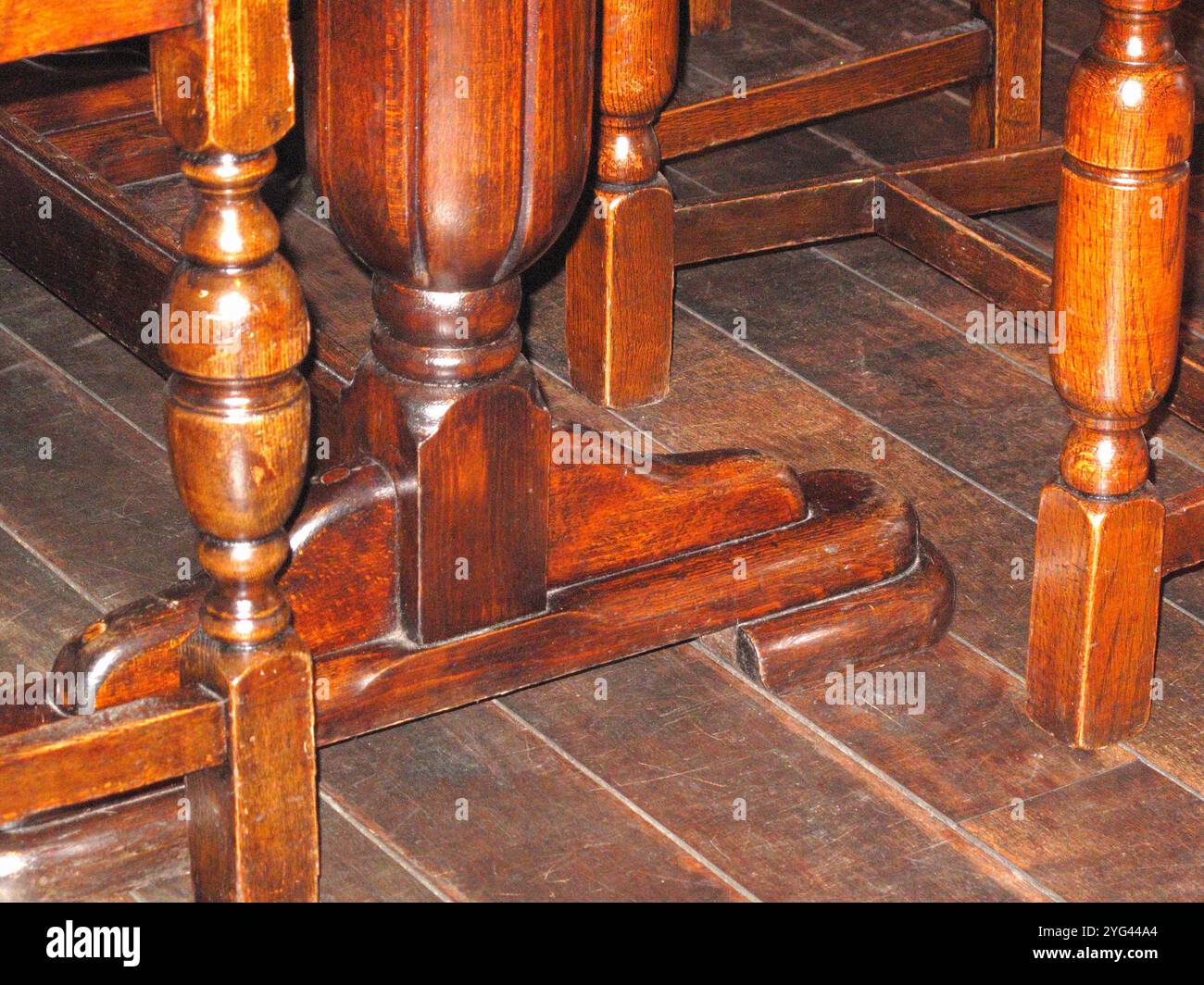 Wooden chairs and table legs in restaurant Stock Photo - Alamy