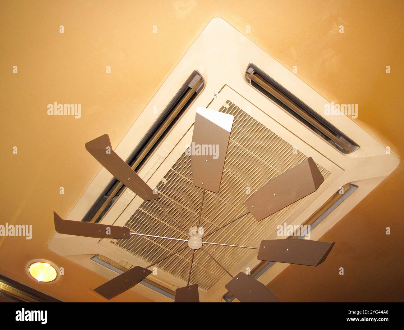 Air conditioner and ceiling fan in the room Stock Photo - Alamy