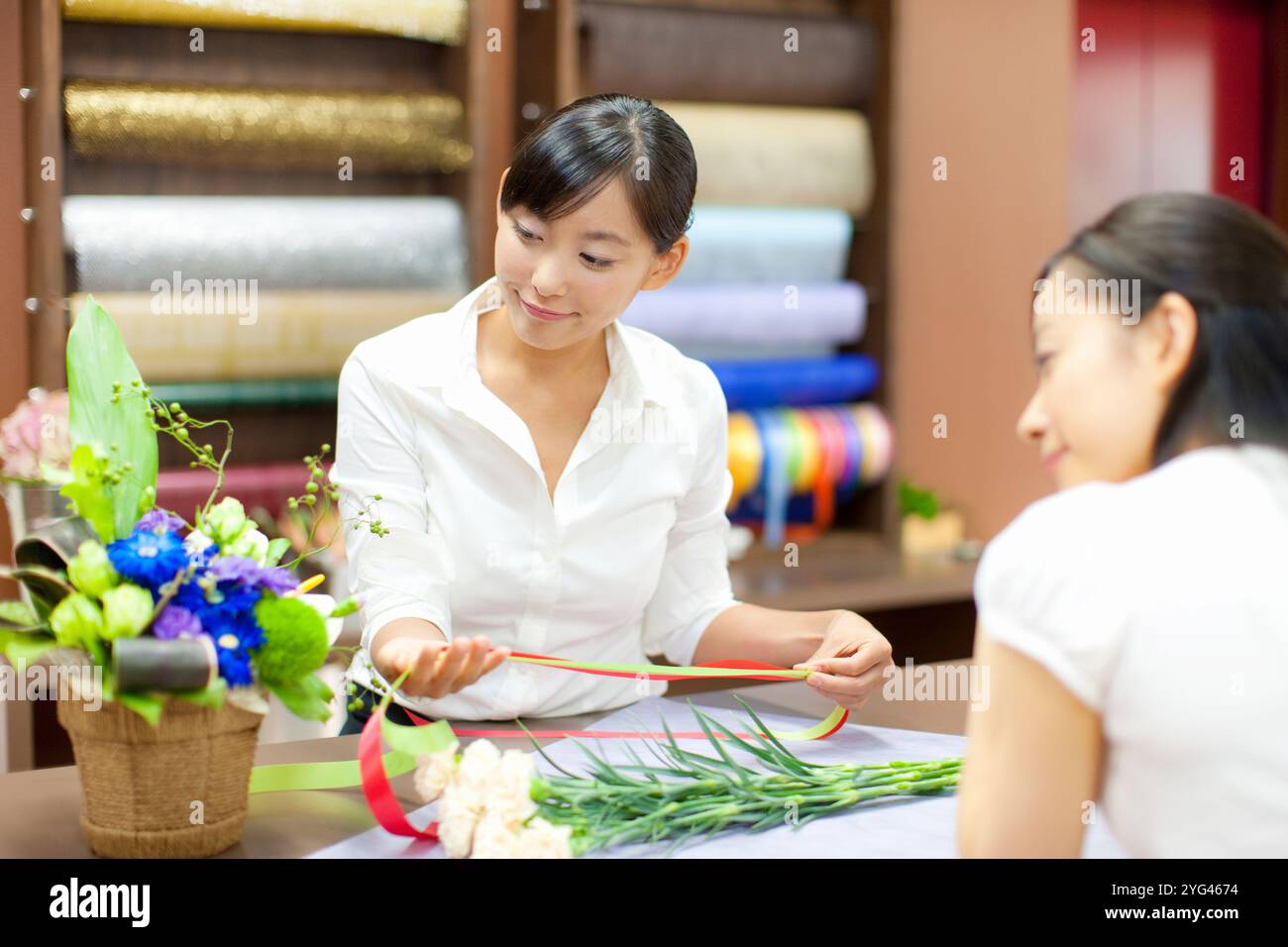 Female shop assistant counter hi-res stock photography and images - Alamy