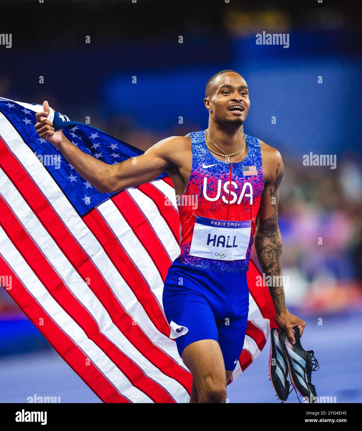 Quincy Hall celebrating her victory with her country's flag at the ...