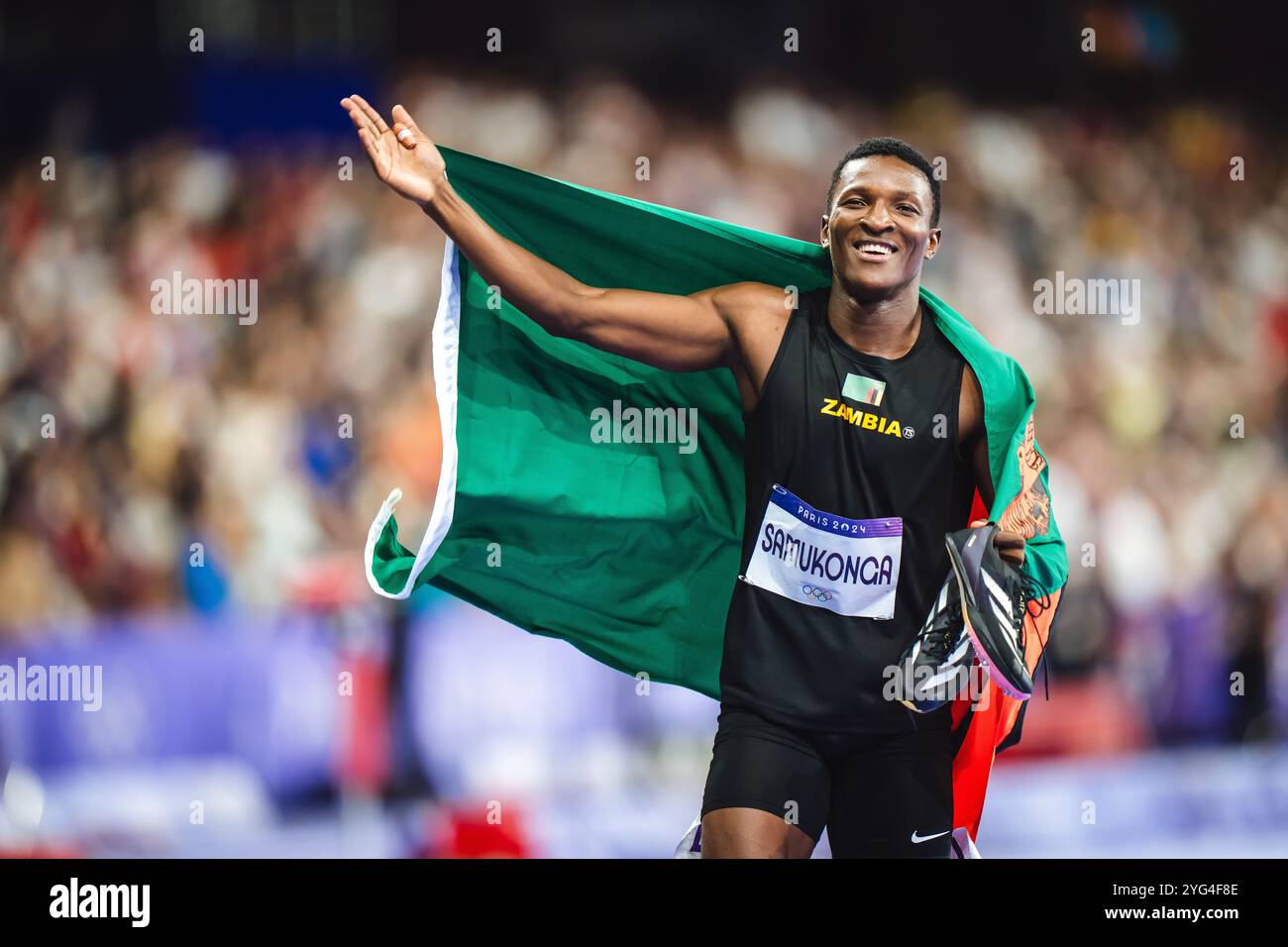 Muzala Samukonga celebrating her victory with her country's flag at the ...