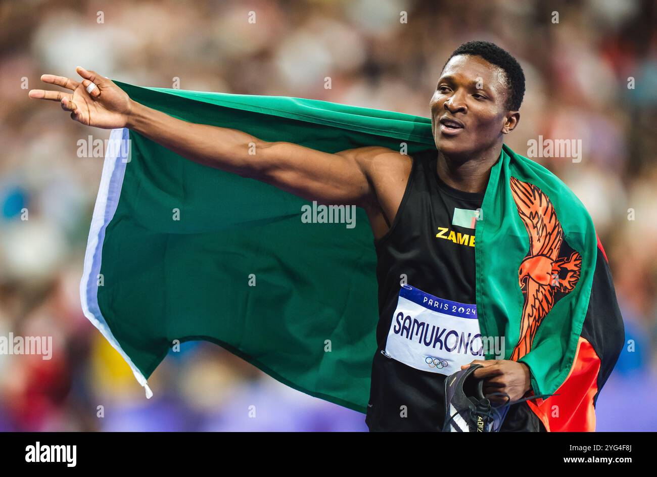 Muzala Samukonga celebrating her victory with her country's flag at the ...