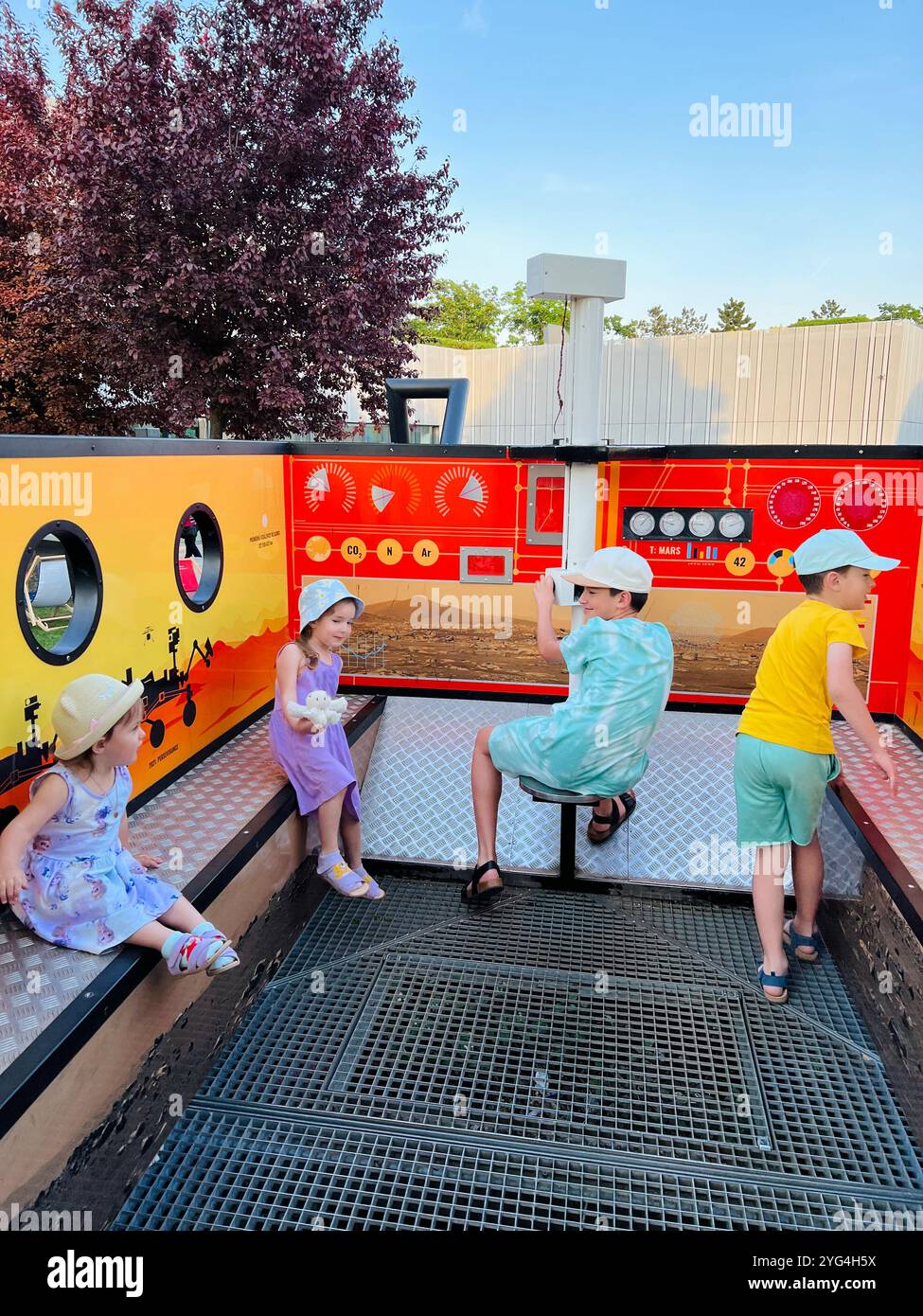 Four children engage in imaginative play at a vibrant interactive ...