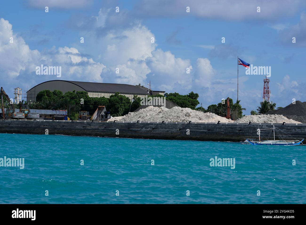 A Philippine flag is seen on Thitu island, locally called Pag-asa ...