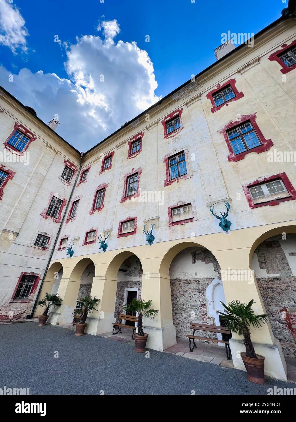 The image showcases a grand European architecture with detailed windows ...