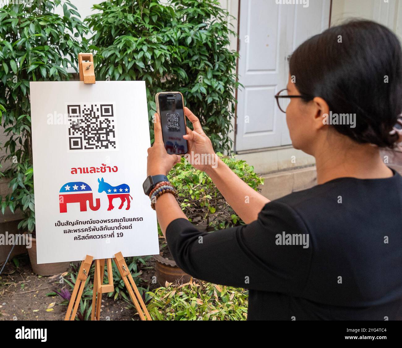 Chiang Mai, Thailand. 06th Nov, 2024. A visitor is scanning a QR code ...