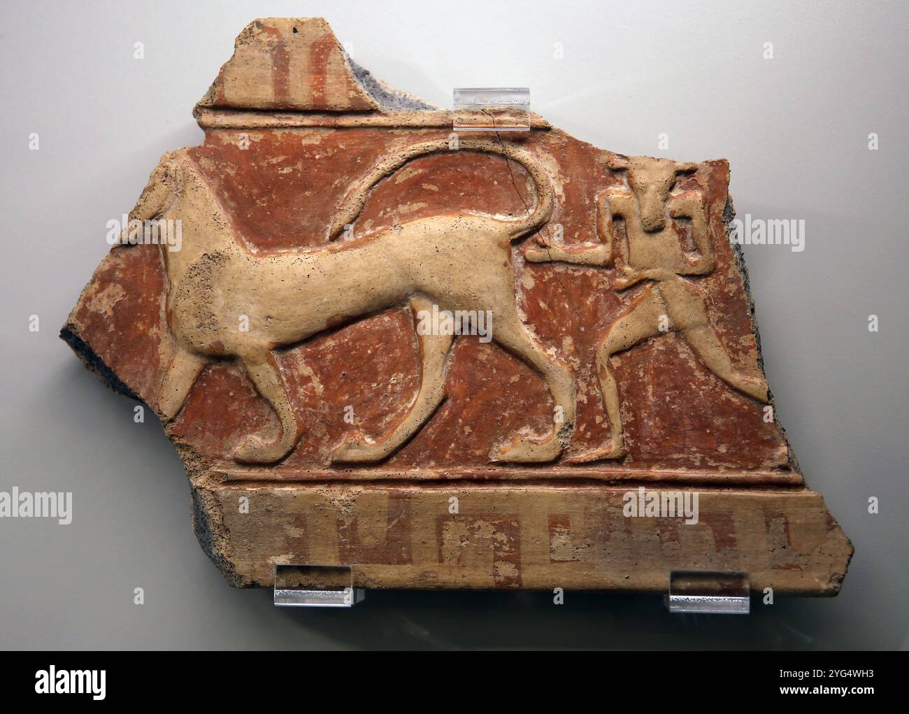 Polychrome terracotta slab. Representing the Minotaur and felines ...