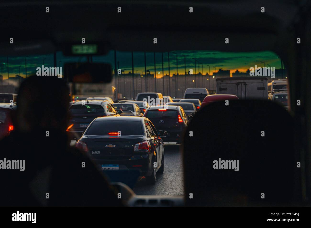 View from inside a car of the rush hour traffic in Egypt in the evening ...