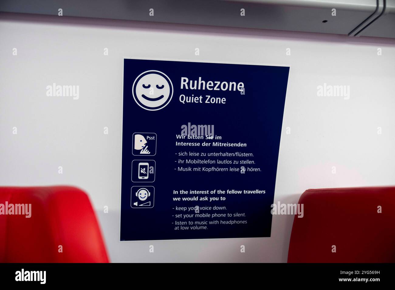 Sign RUHEZONE - QUIET ZONE seen inside train at premier in Austria of a ...