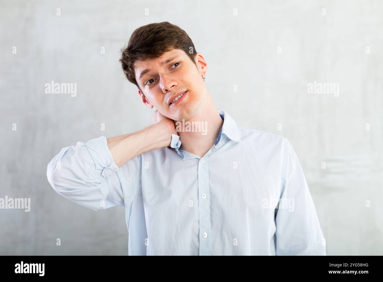Neck pain unhealthy posture indoors hi-res stock photography and images ...