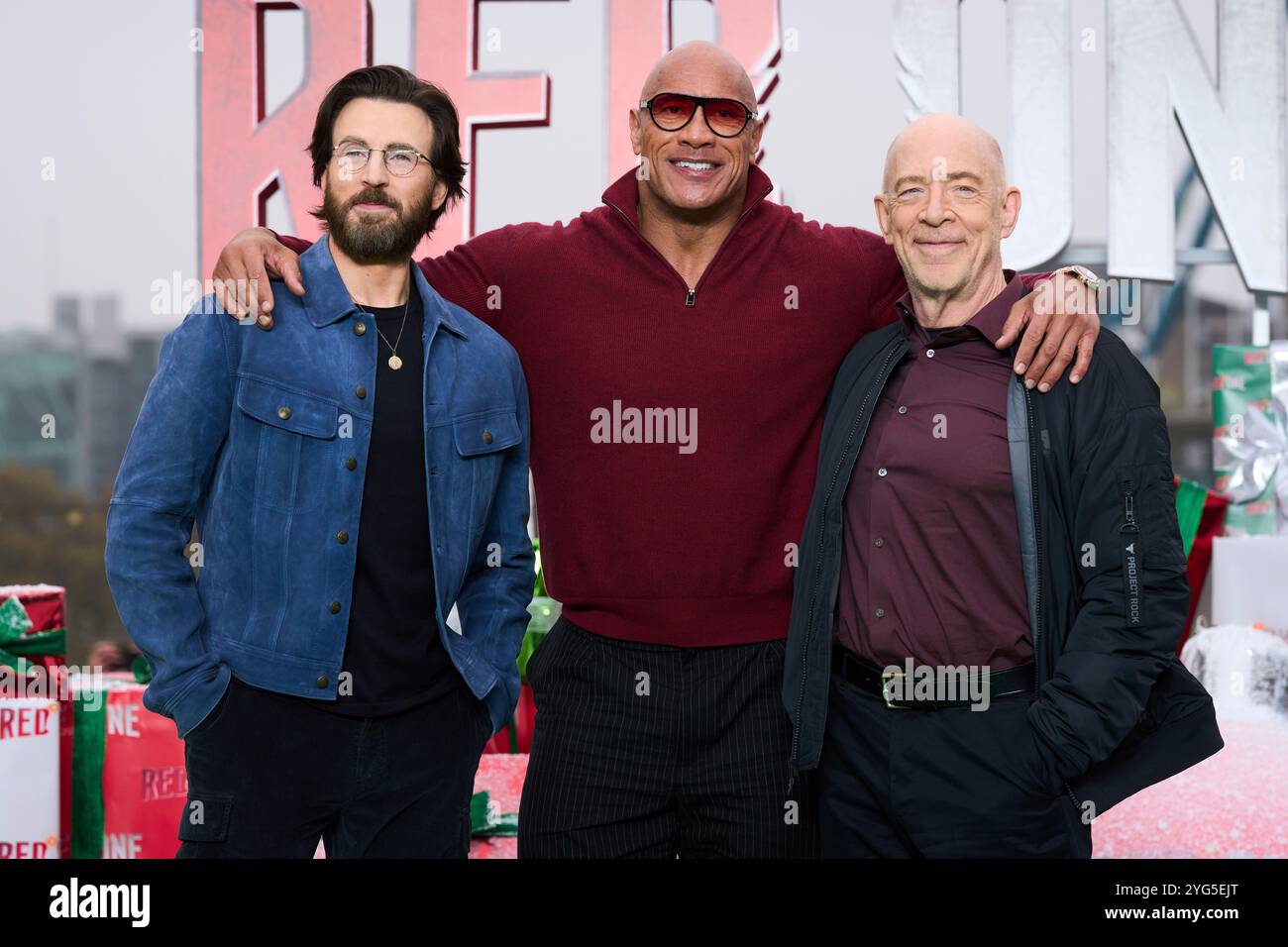 Chris Evans, from left, Dwayne Johnson and J. K. Simmons pose for ...