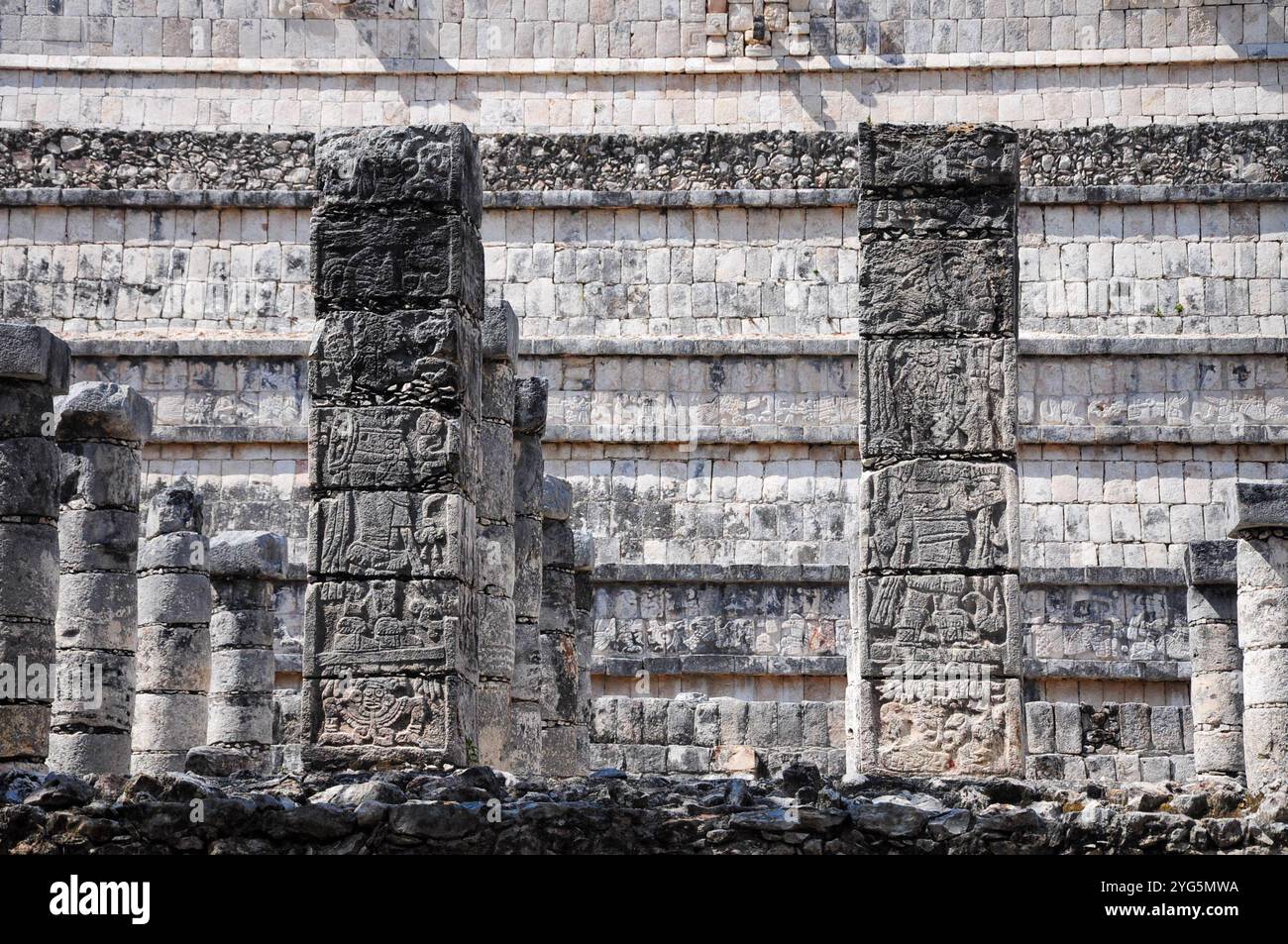 Ancient stone columns and carvings at Chichen Itza historic site in Mexico Stock Photo - Alamy