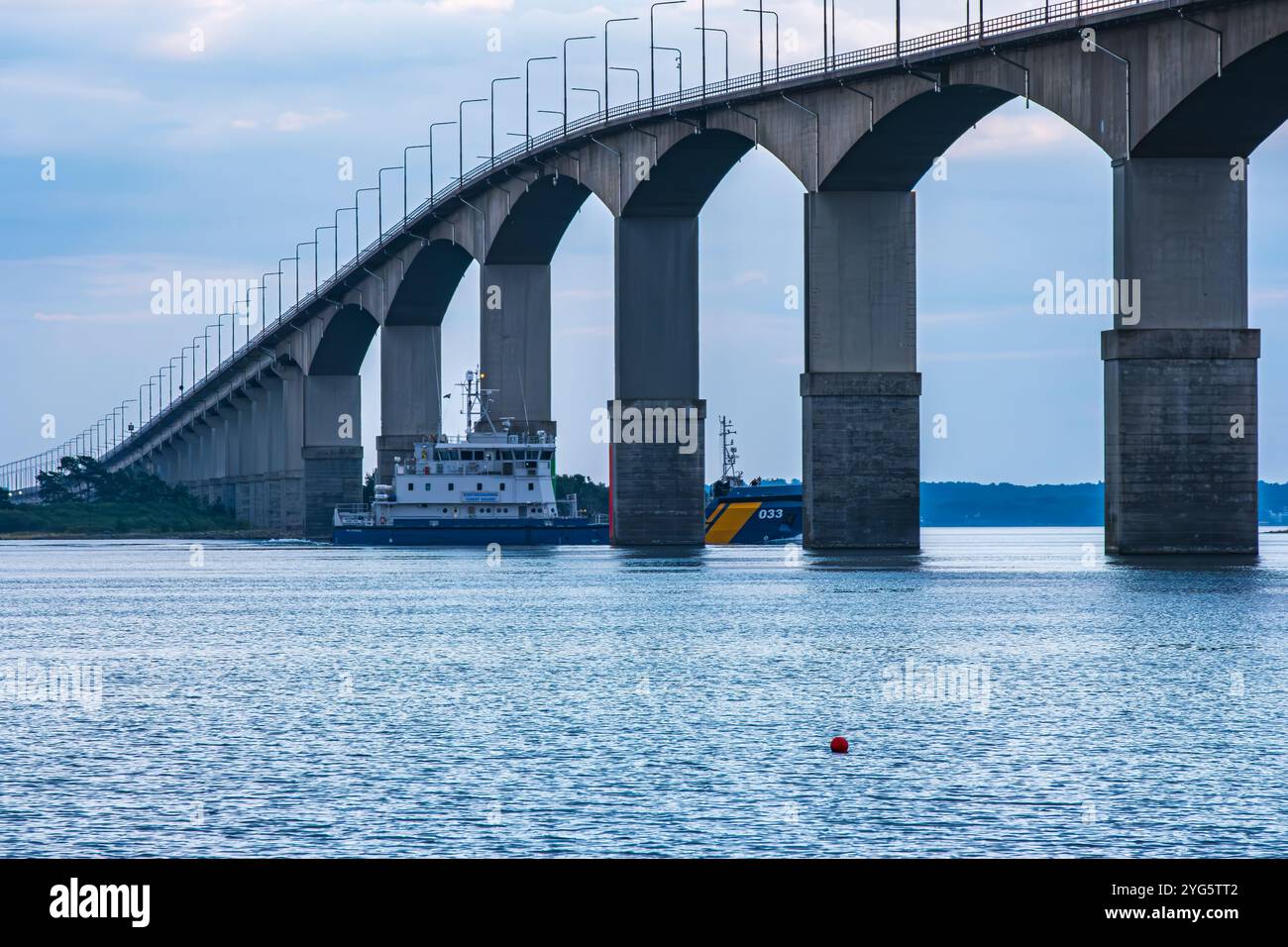 A Swedish Coast Guard ship passes the Öland Bridge (Ölandsbron) in the ...