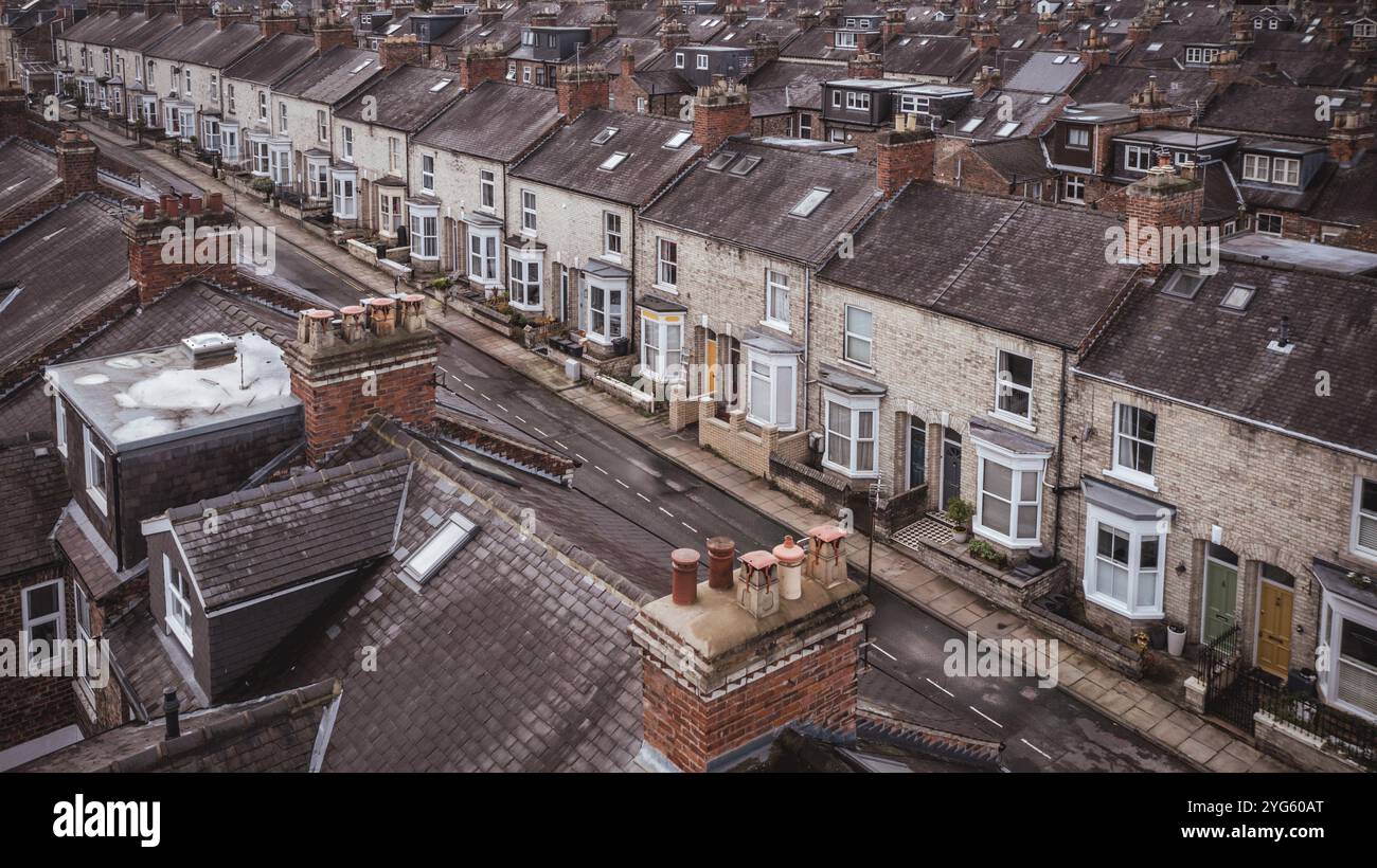An aerial view above the rooftops of run down back to back terraced ...