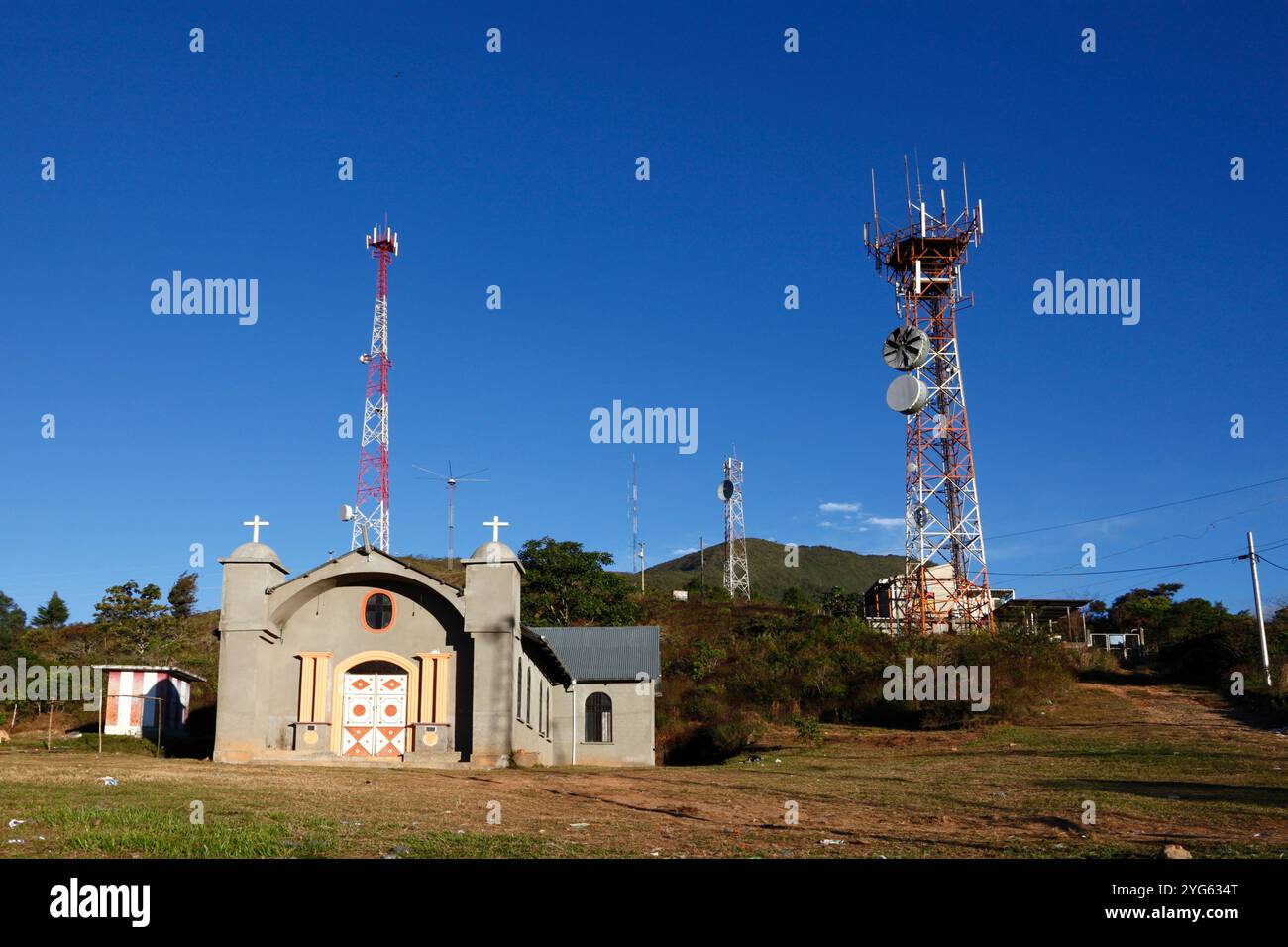 Mobile phone / radio masts and modern concrete Calvario church, Coroico ...