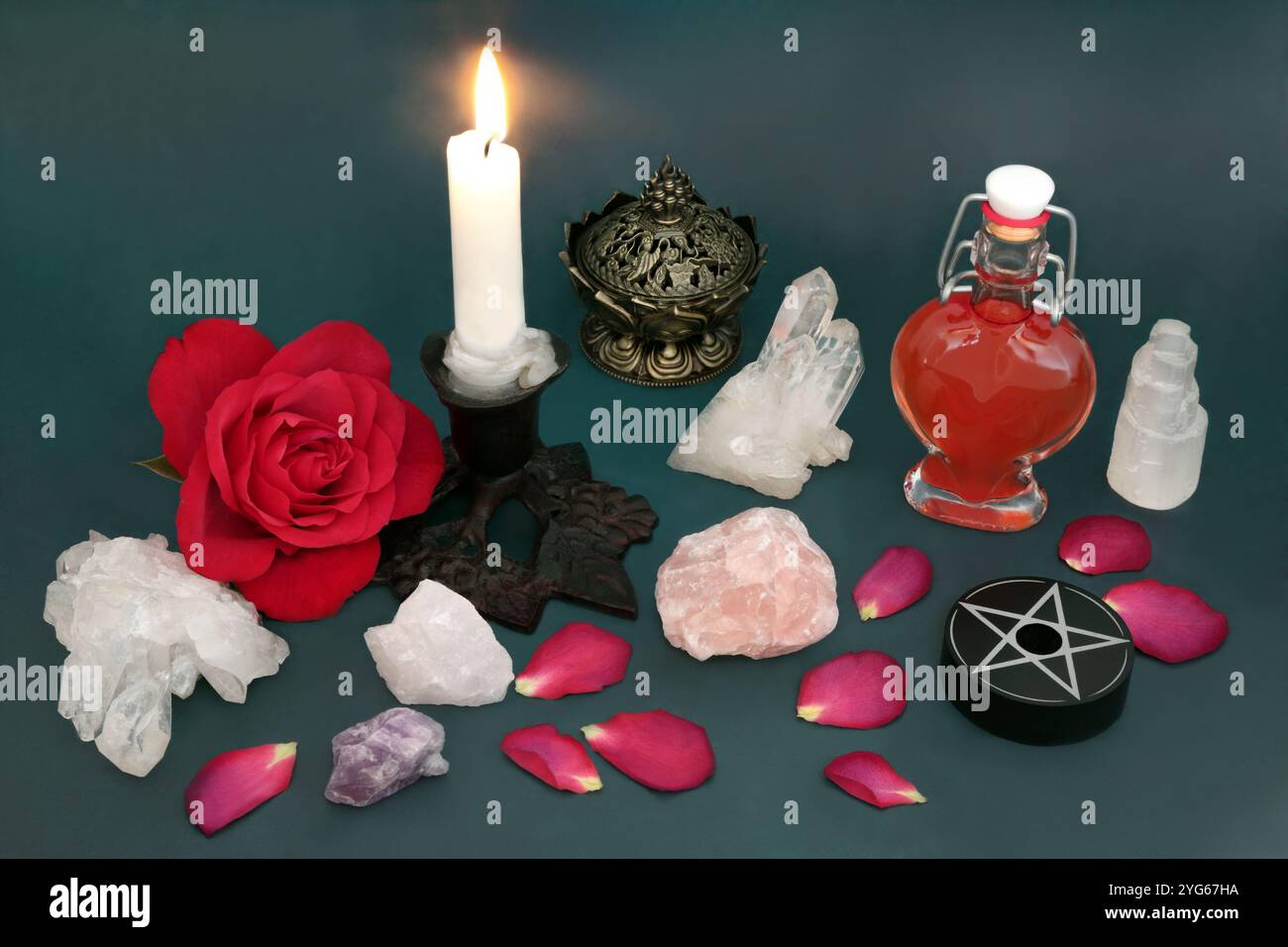 Love potion concept with red rose flower and petals, crystals, heart ...