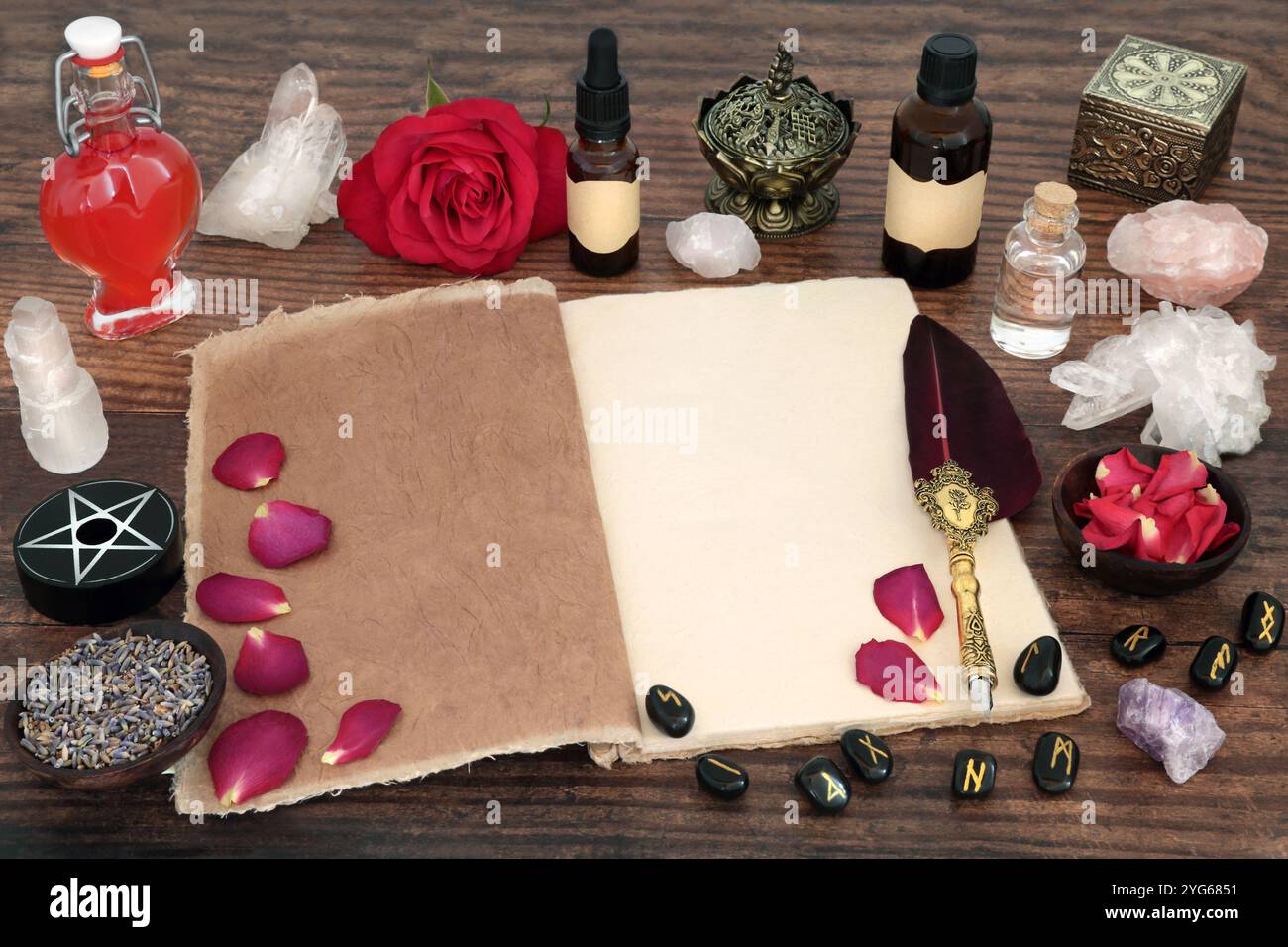 Witchcraft love potion with rose flower, magical equipment and book of ...