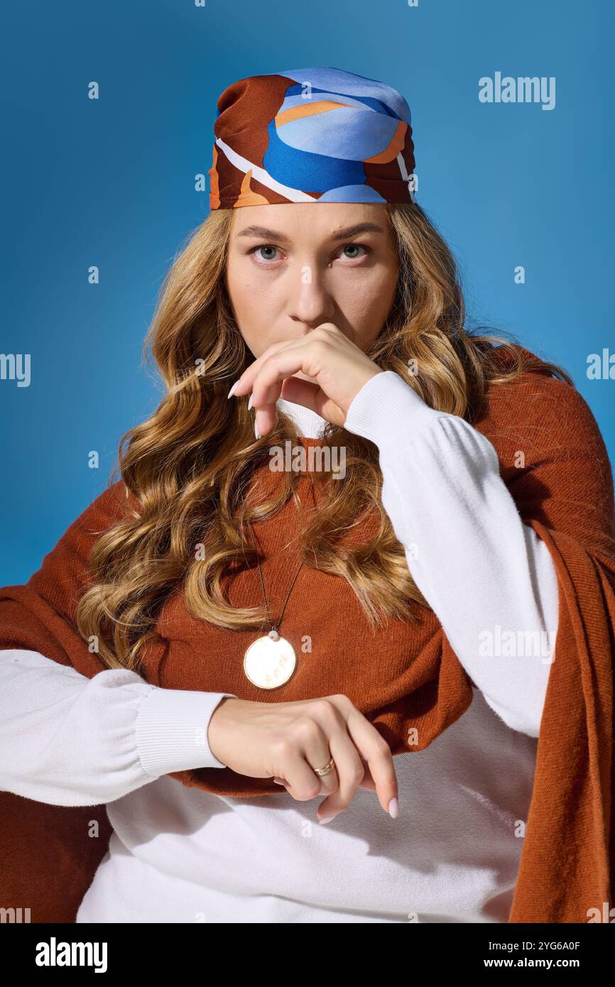 A young beautiful plus size woman showcases her style with bold colors ...