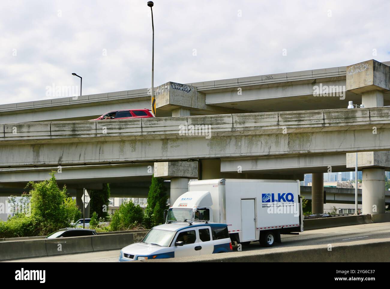View from inside a car driving north on Interstate 5 with concrete ...