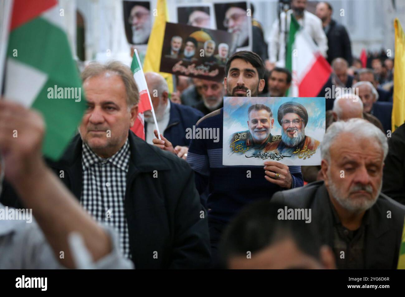 Tehran, Iran. 6th Nov, 2024. An Iranian man holds a poster of the late ...