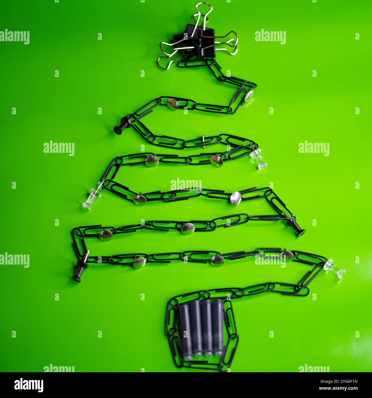 An innovative Christmas tree design crafted using office supplies, like ...