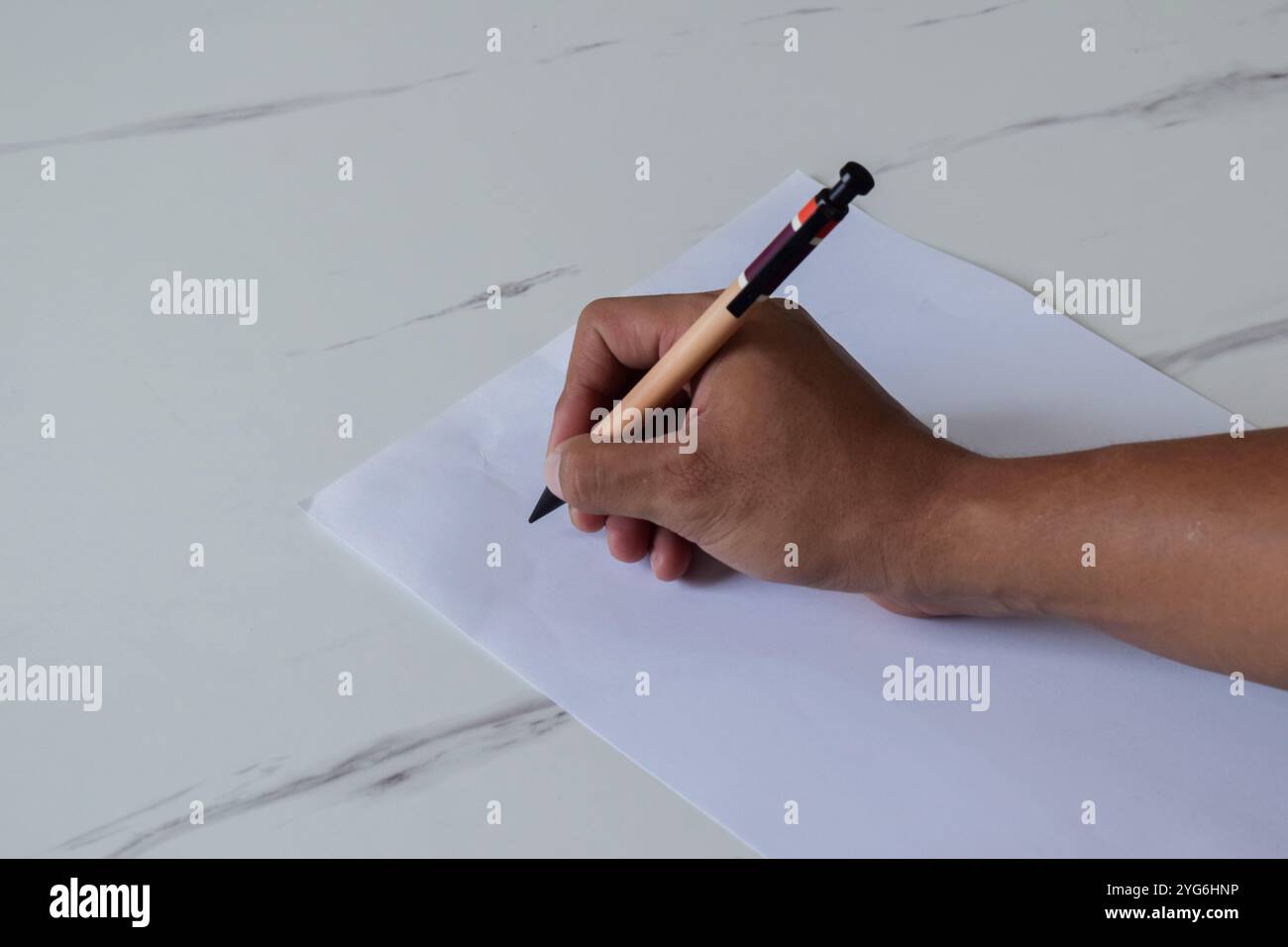 Man writing on sheet paper hi-res stock photography and images - Alamy