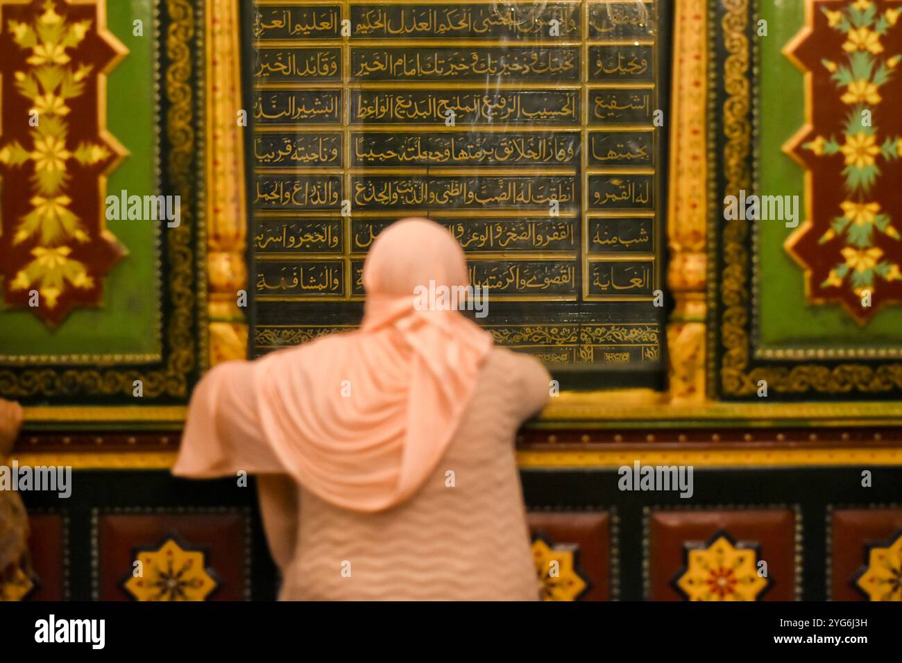 A Kashmiri woman prays inside a shrine on the first day of Ramadan in ...