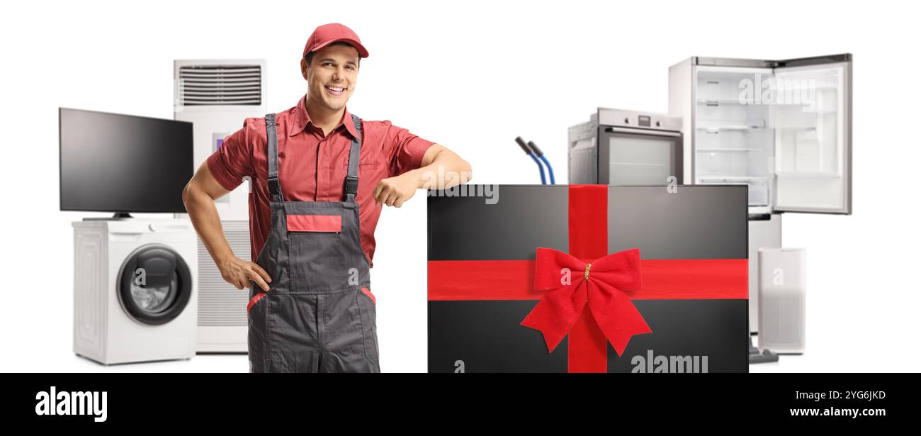 Worker with home appliances and a tv screen in a store isolated on ...