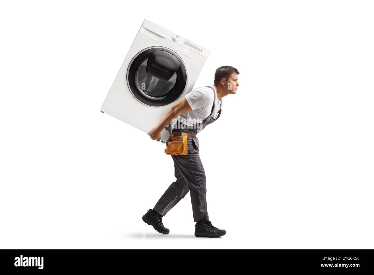 Repairman carrying a washing machine on his back isolated on white ...