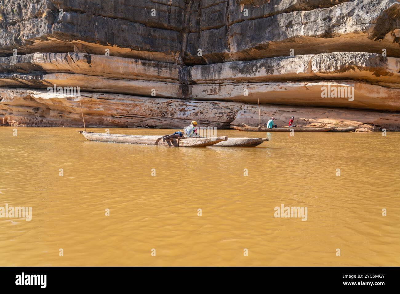 Manambolo River, Madagascar - August 28, 2024: Local boatmen rest on ...