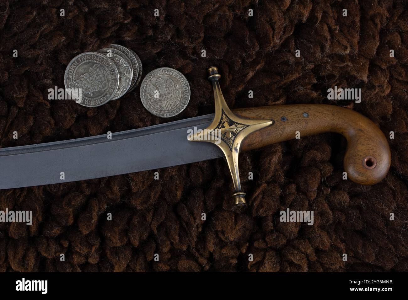 Ukraine Saber Sword with silver taller coins on fur background, 17th ...
