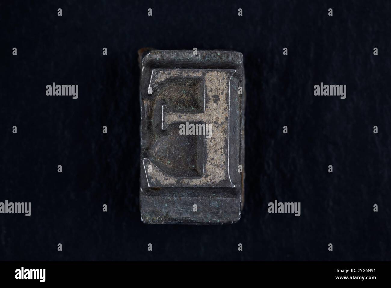 movable type alphabet letter E on black background Stock Photo - Alamy