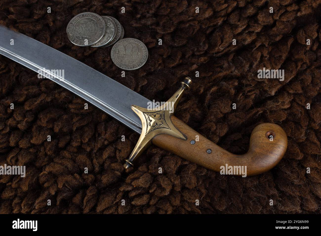 Ukraine Saber Sword with silver taller coins on fur background, 17th ...